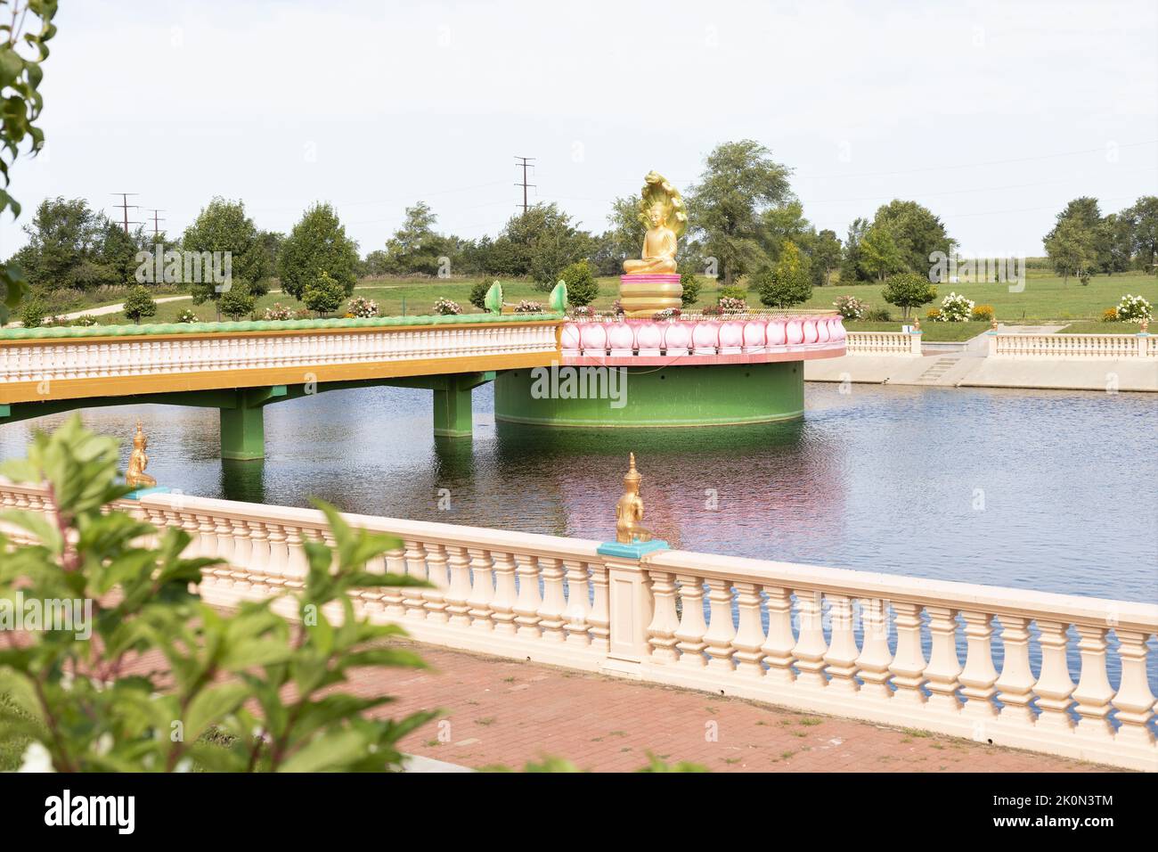 A gold Buddha with serpents statue at Watt Munisotaram Cambodian ...