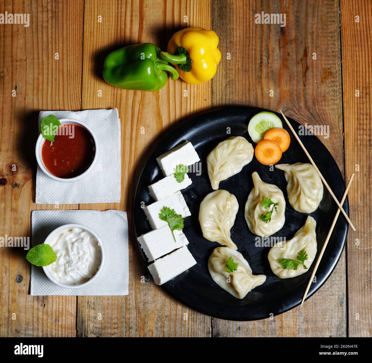 A top view of chicken momos with sauces Stock Photo - Alamy