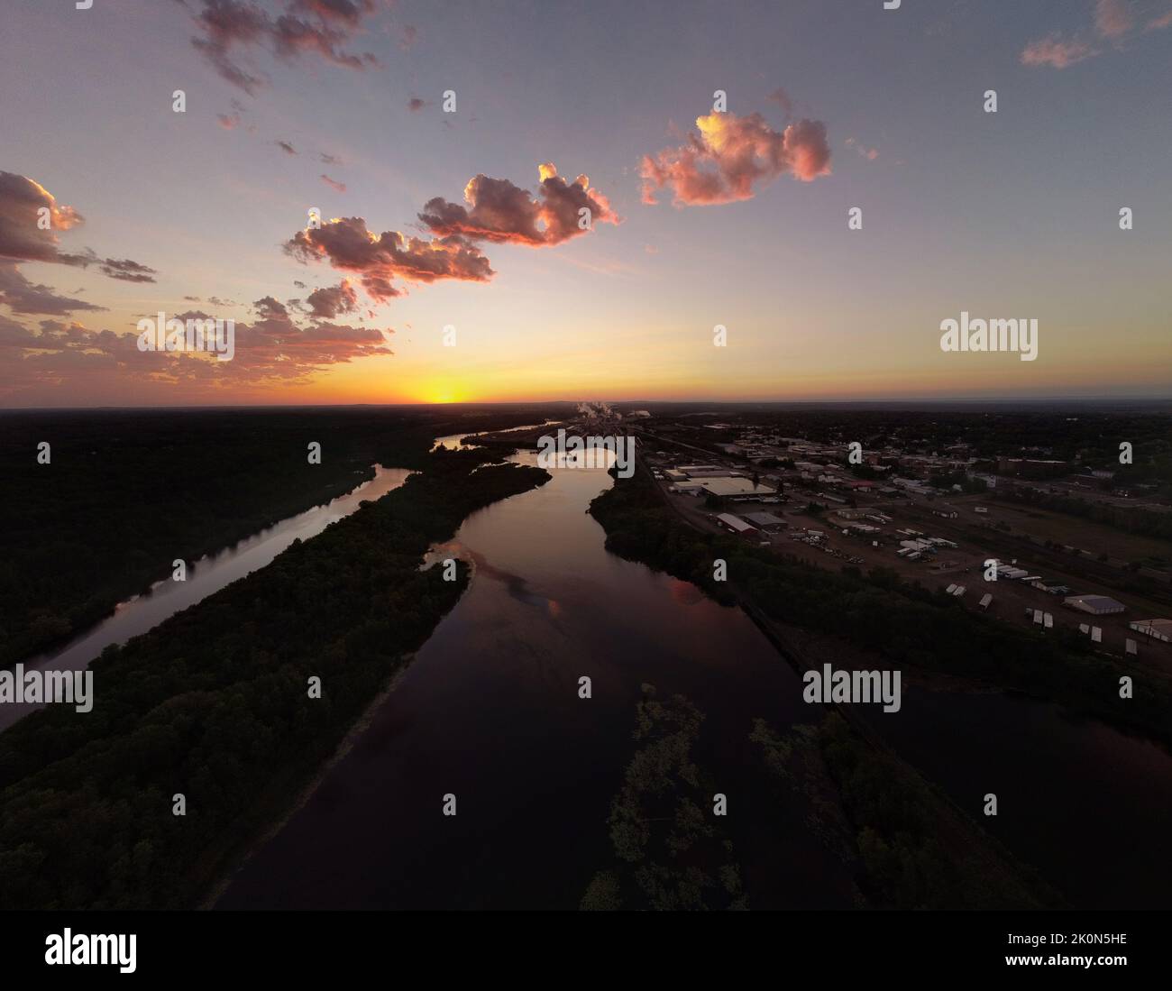 An aerial view of a scenic sunset over a riverside city Stock Photo - Alamy