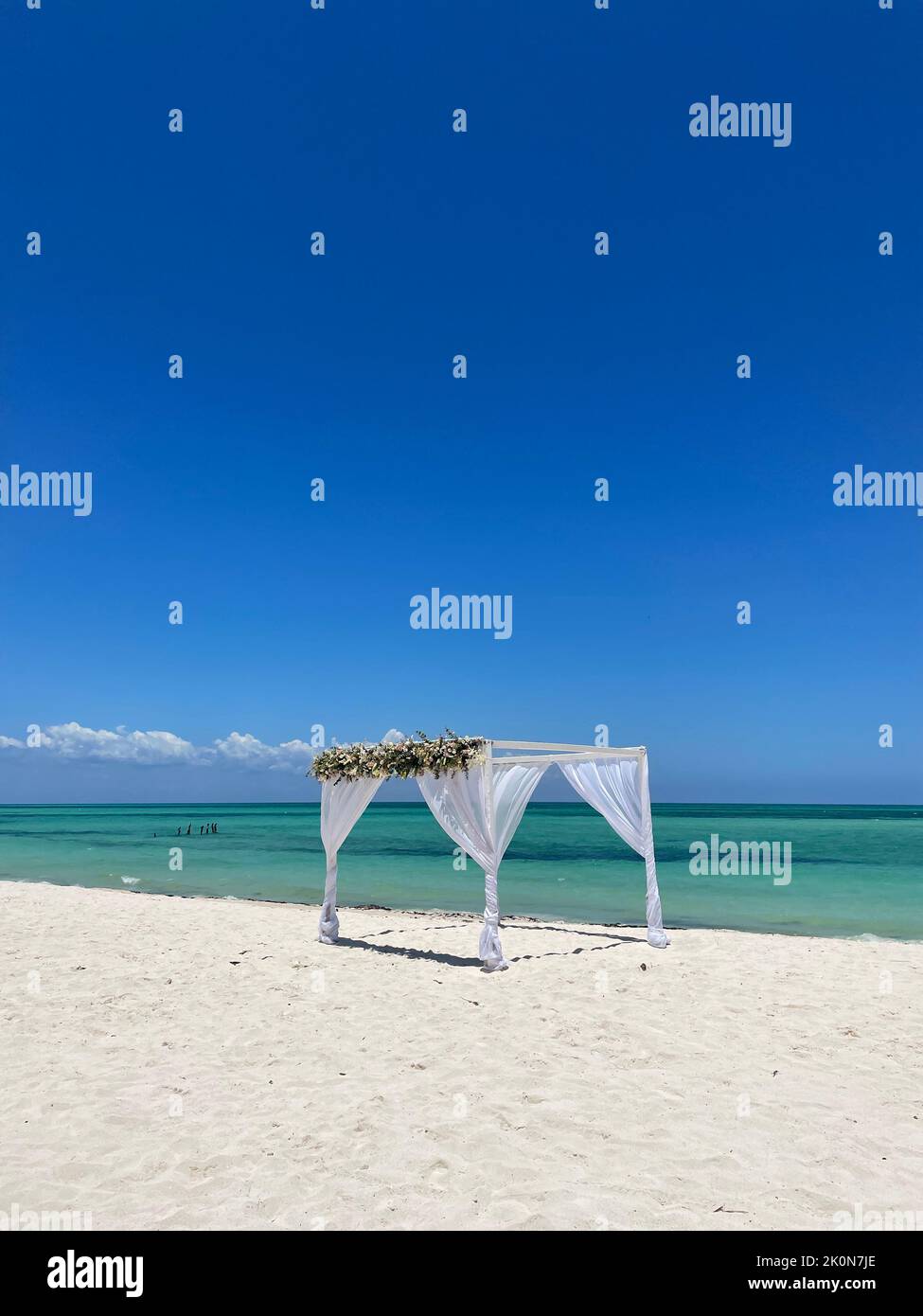 A beach wedding gazebo in clear sunny weather - vertical Stock Photo ...
