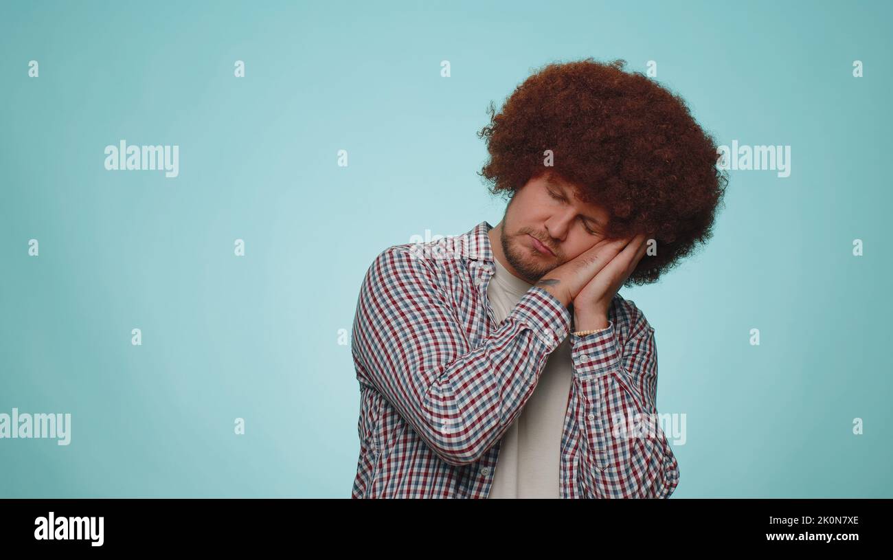 Tired handsome bearded man with lush hair coiffure yawning, sleepy ...