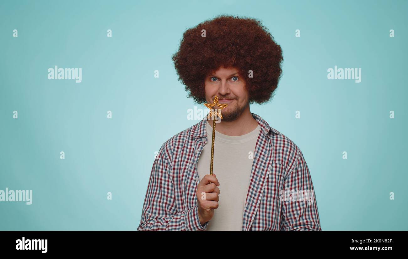 Magician wizard man gesturing with magic wand fairy stick, making wish ...