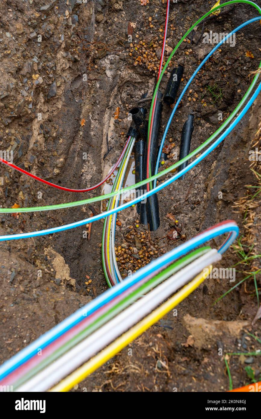 Laying of fibre optic cables, construction site, excavation pit ...