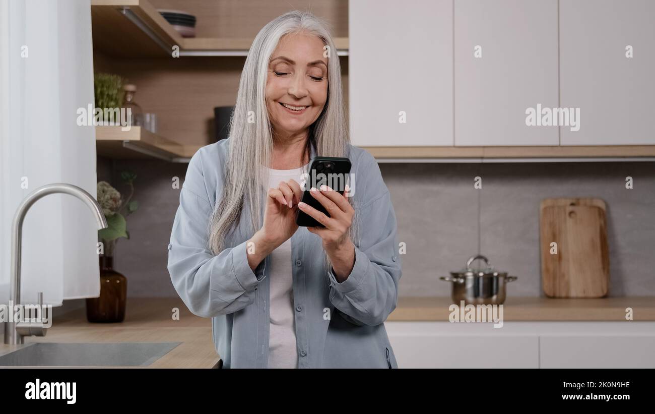 Excited happy elderly woman amazed female grey-haired granny pensioner ...