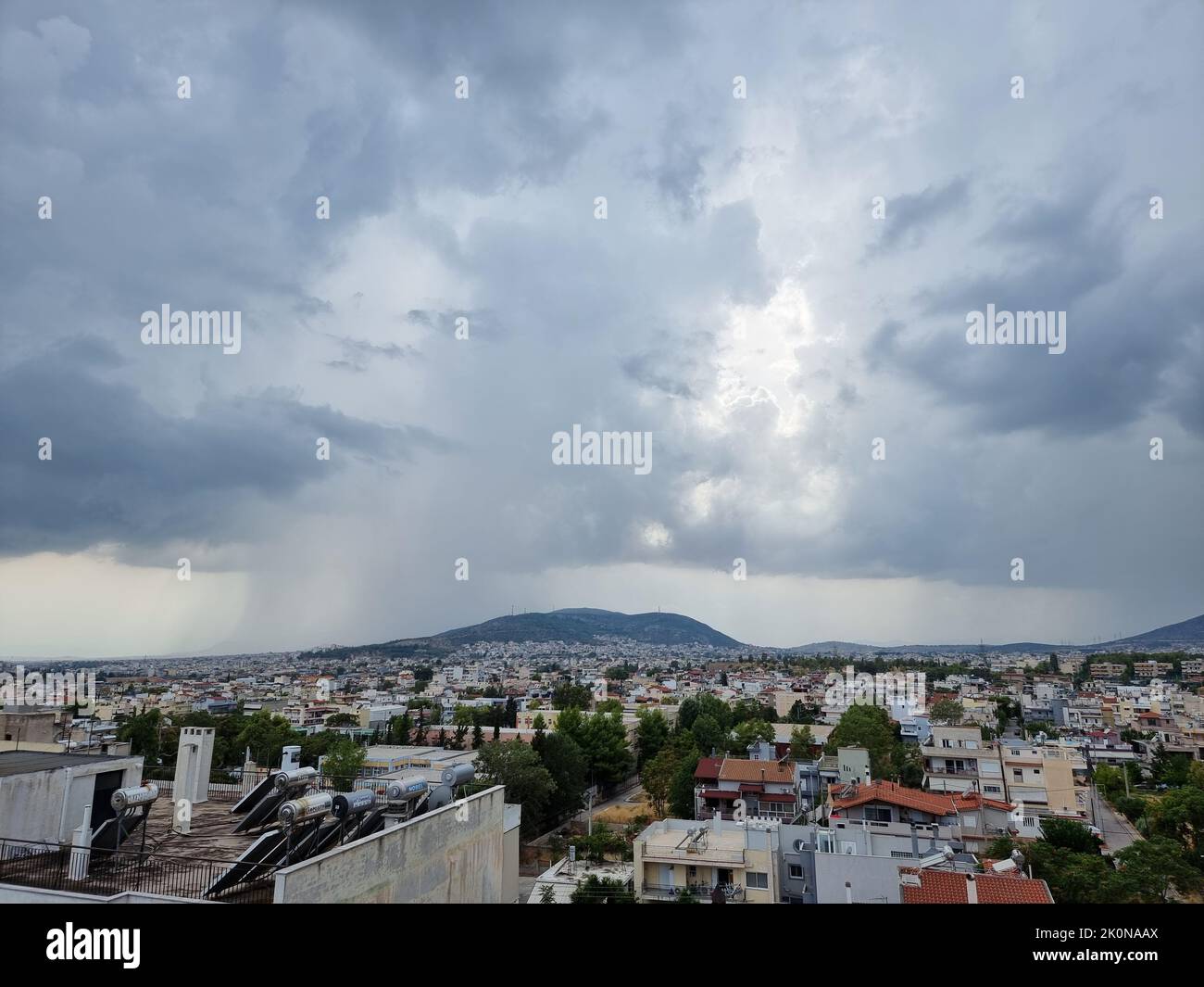 An aerial view of a city under a cloudy sky Stock Photo - Alamy