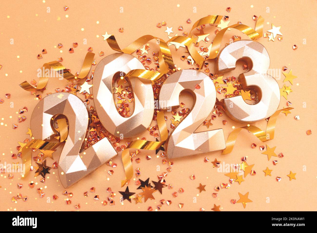 Closeup of 2023 gold colored numbers, stars confetti and ribbons. New ...