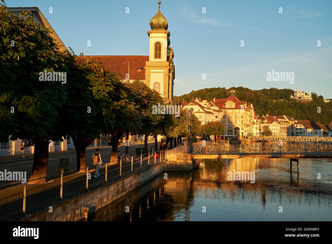 Old Baroque styled church near river in Switzerland Stock Photo - Alamy