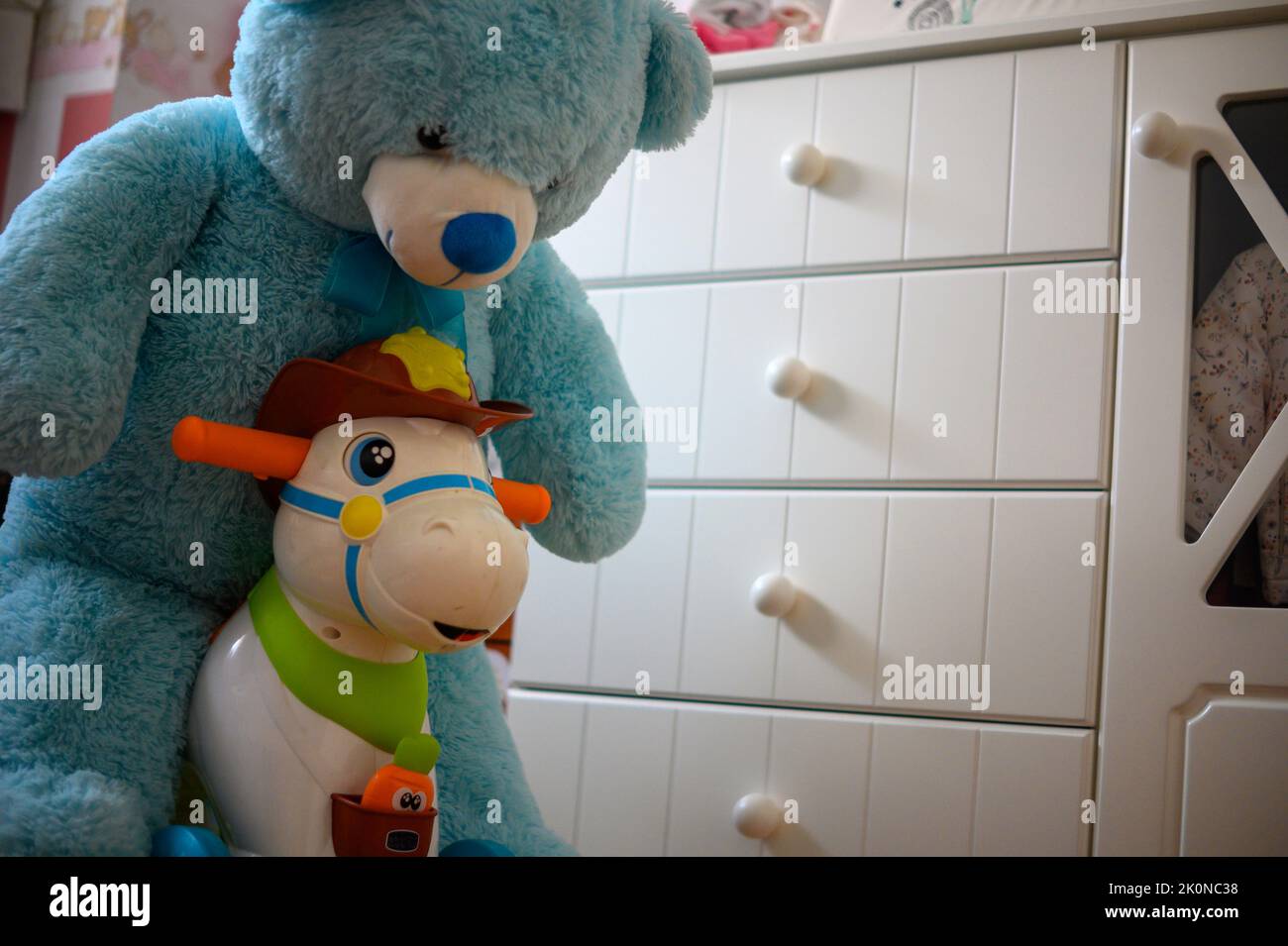Bear sitting on toy horse hi-res stock photography and images - Alamy