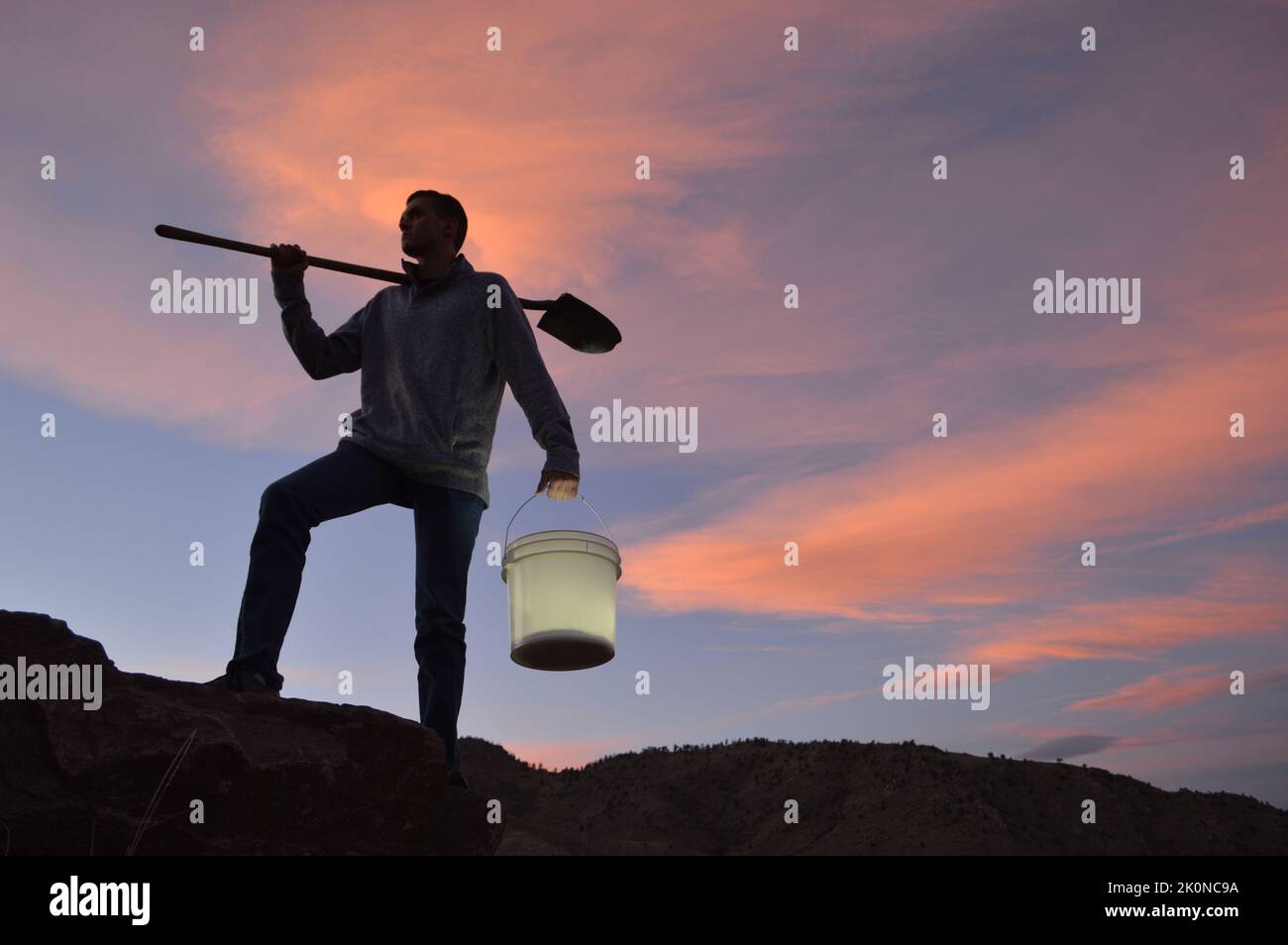 Man carrying bucket hi-res stock photography and images - Alamy