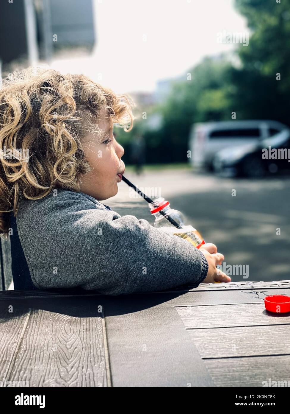 child drinking water from a straw Stock Photo - Alamy