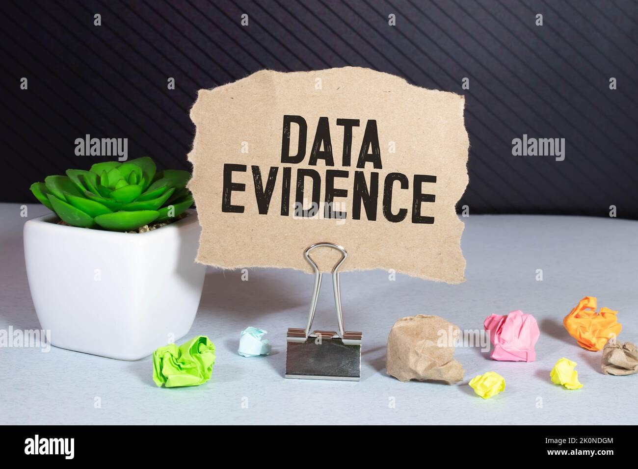 DATA EVIDENCE - business concept, text on a notebook with a spring on a pink background Stock ...