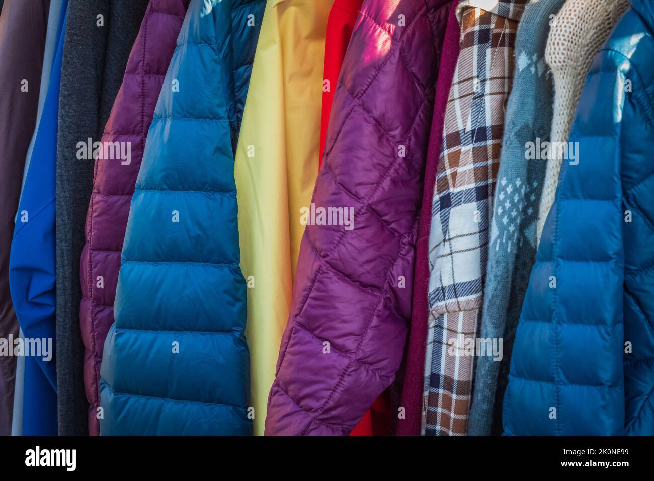 Coats on rack male female hi-res stock photography and images - Alamy