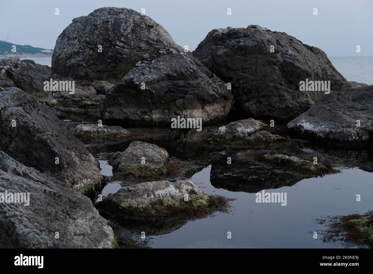 Rock formations on the background of the sea in the early morning ...