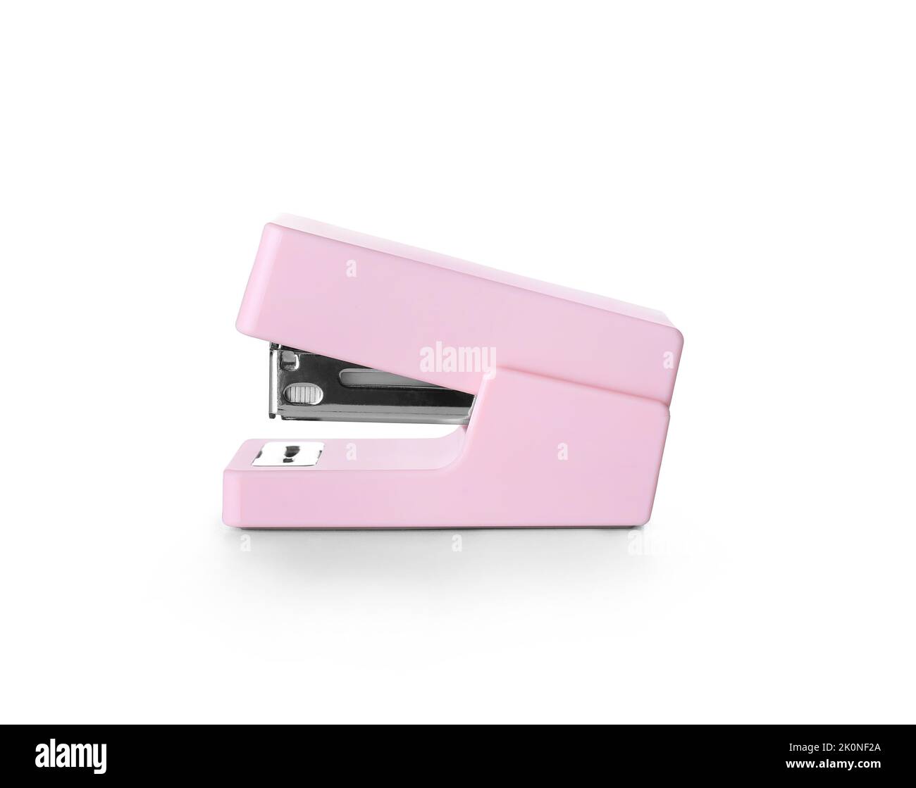 Modern pink stapler on white background Stock Photo - Alamy