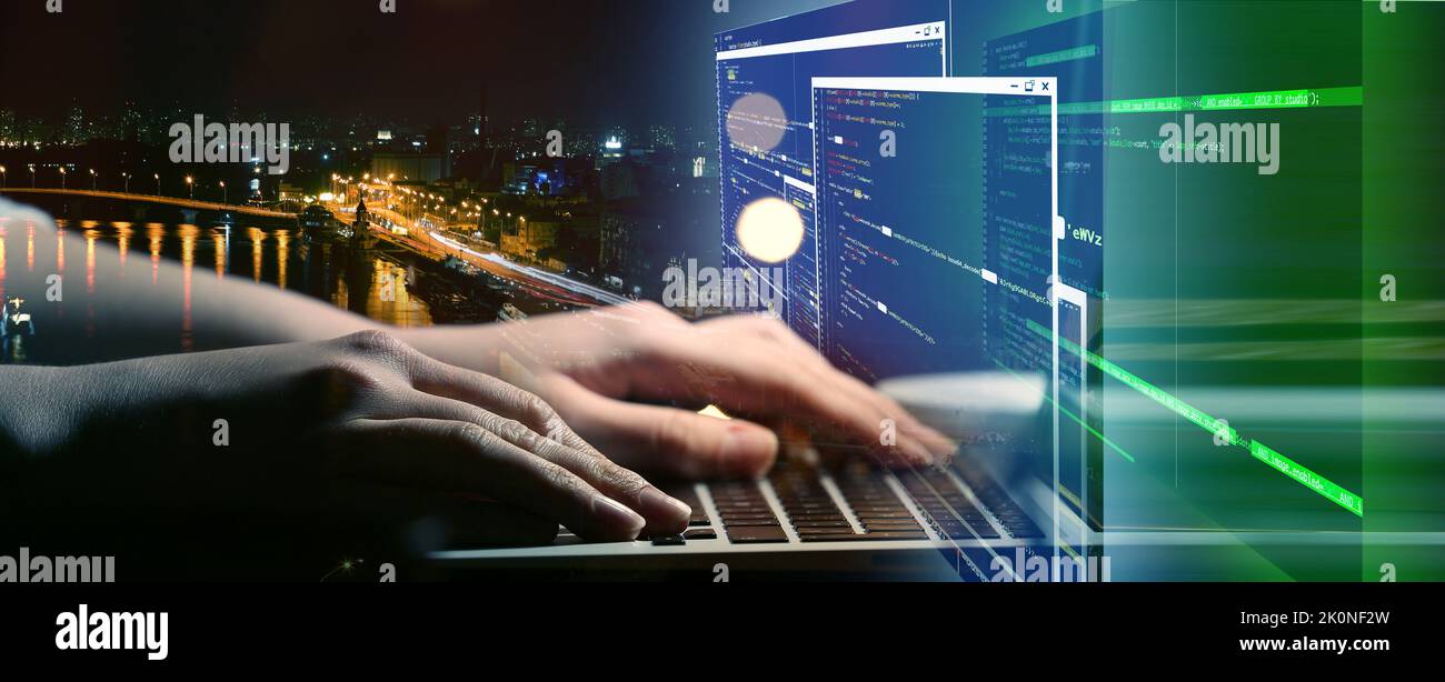 Double exposure of programmer with laptop in office and night city Stock Photo - Alamy