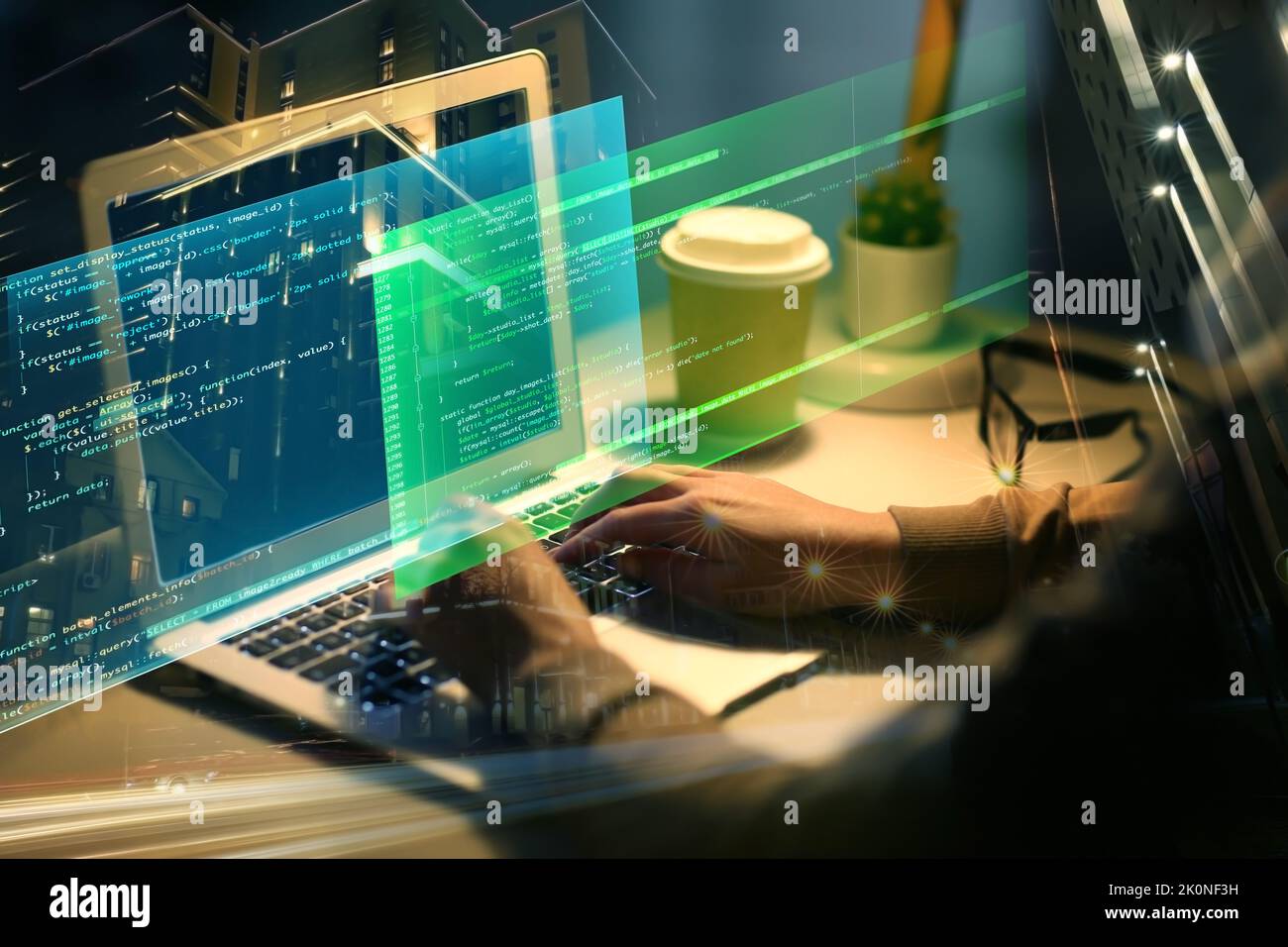 Double exposure of programmer with laptop in office and night city Stock Photo - Alamy