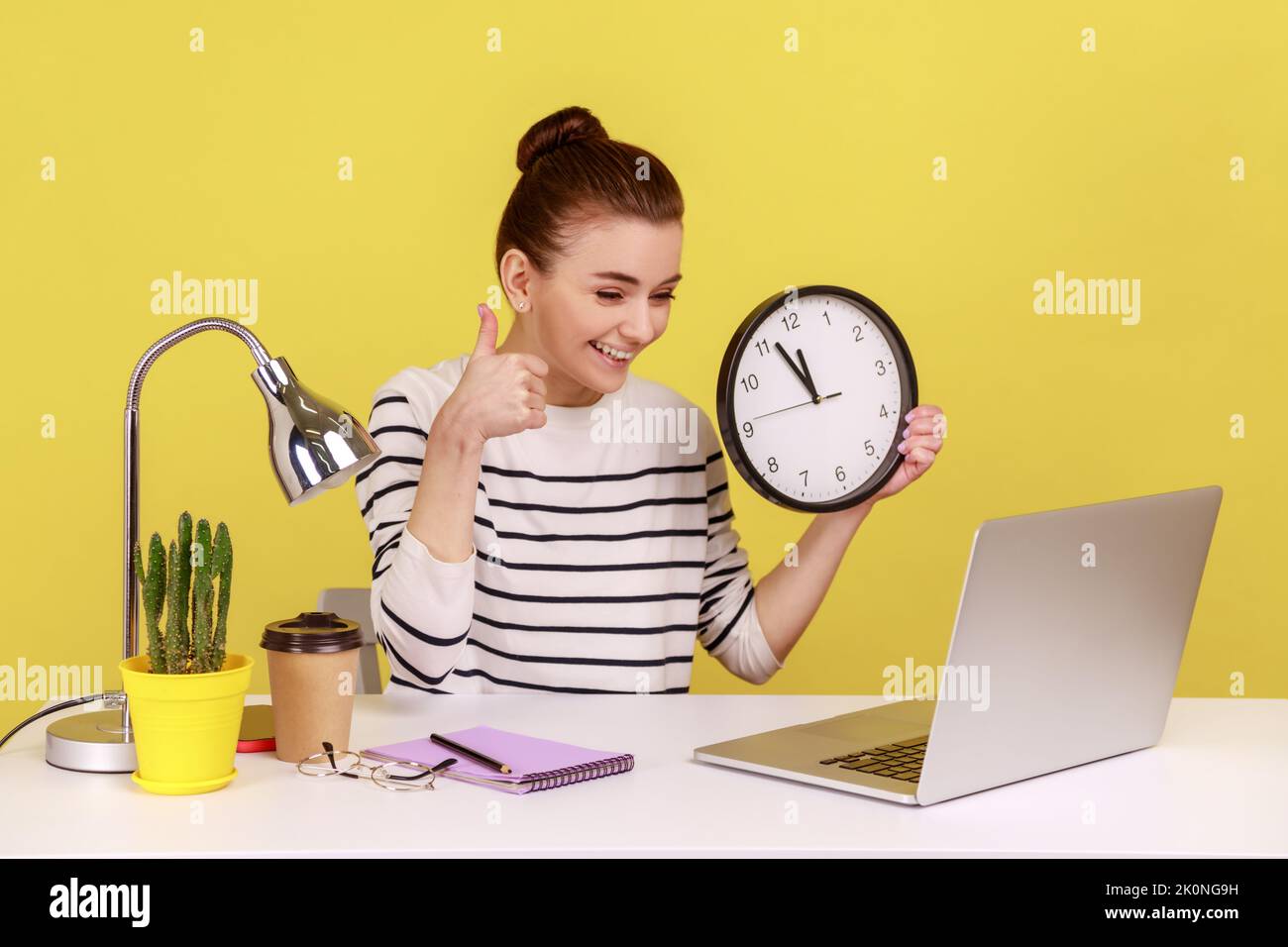 Delighted happy woman office worker showing thumbs up to laptop screen ...