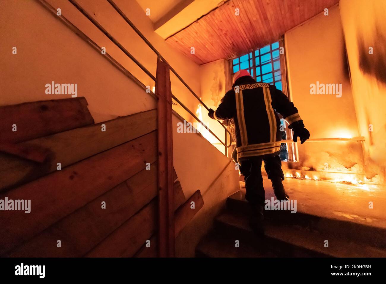 Brave Fireman going upstairs to save and rescue people in a Burning ...
