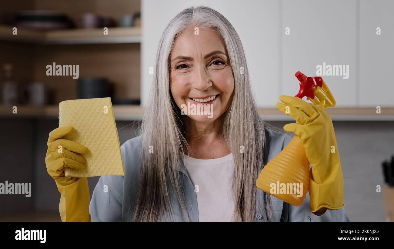 Old housewife happy maid female cleanup worker housekeeper stand in ...