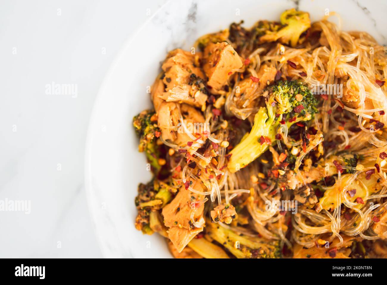 broccoli and plant-based chicken stiry fry with vermicelli noodles ...