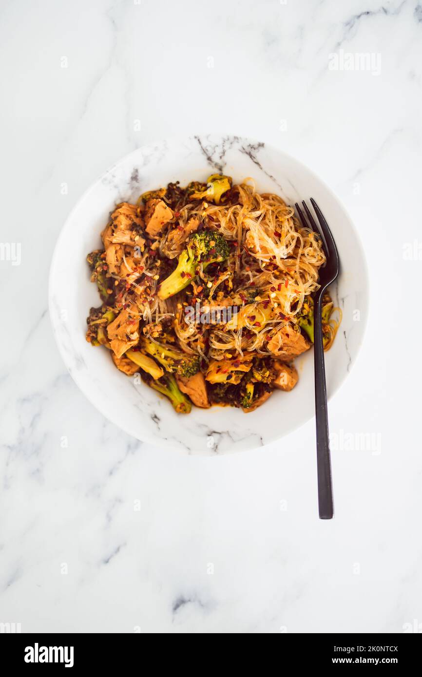 broccoli and plant-based chicken stiry fry with vermicelli noodles ...