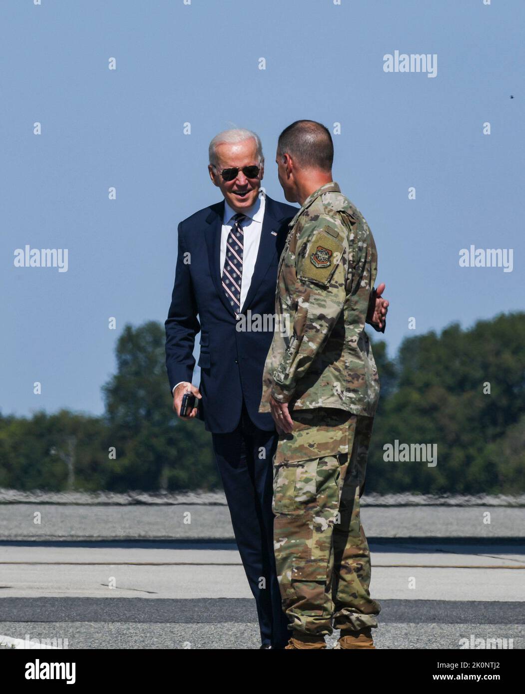 U.S. President Joe Biden, left, walks towards Marine One, accompanied ...