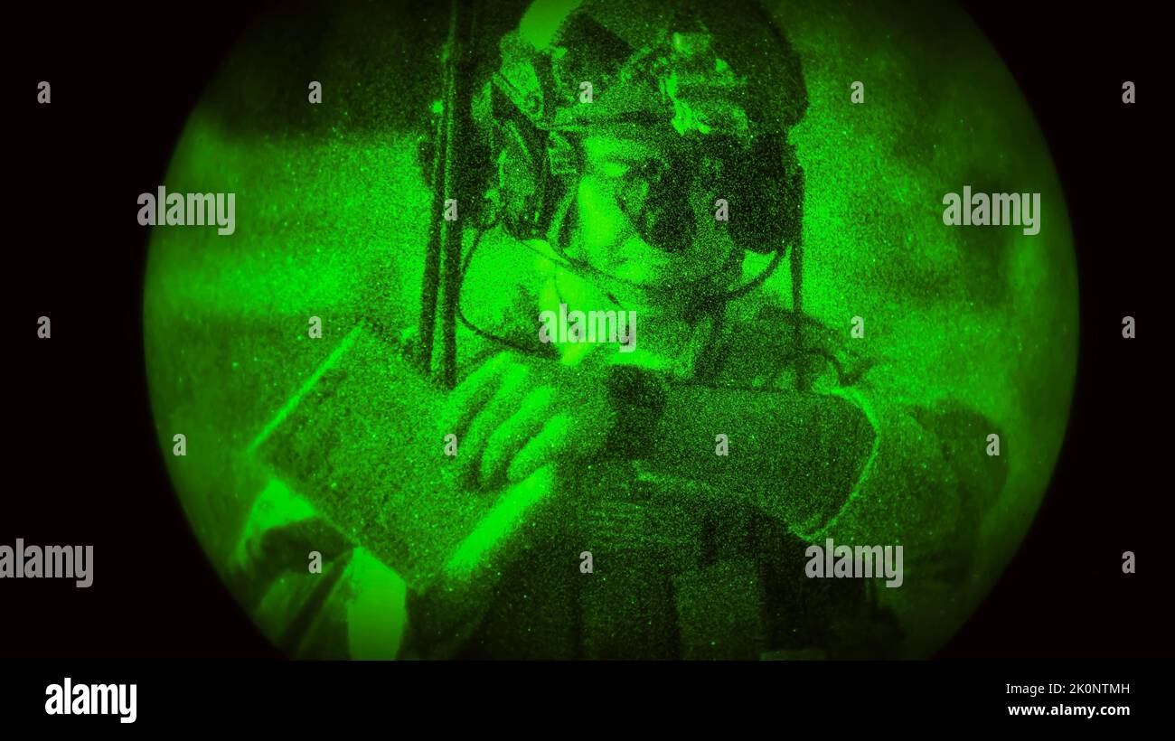 A U.S. Joint Terminal Attack Controller (JTAC) coordinates targets with ...