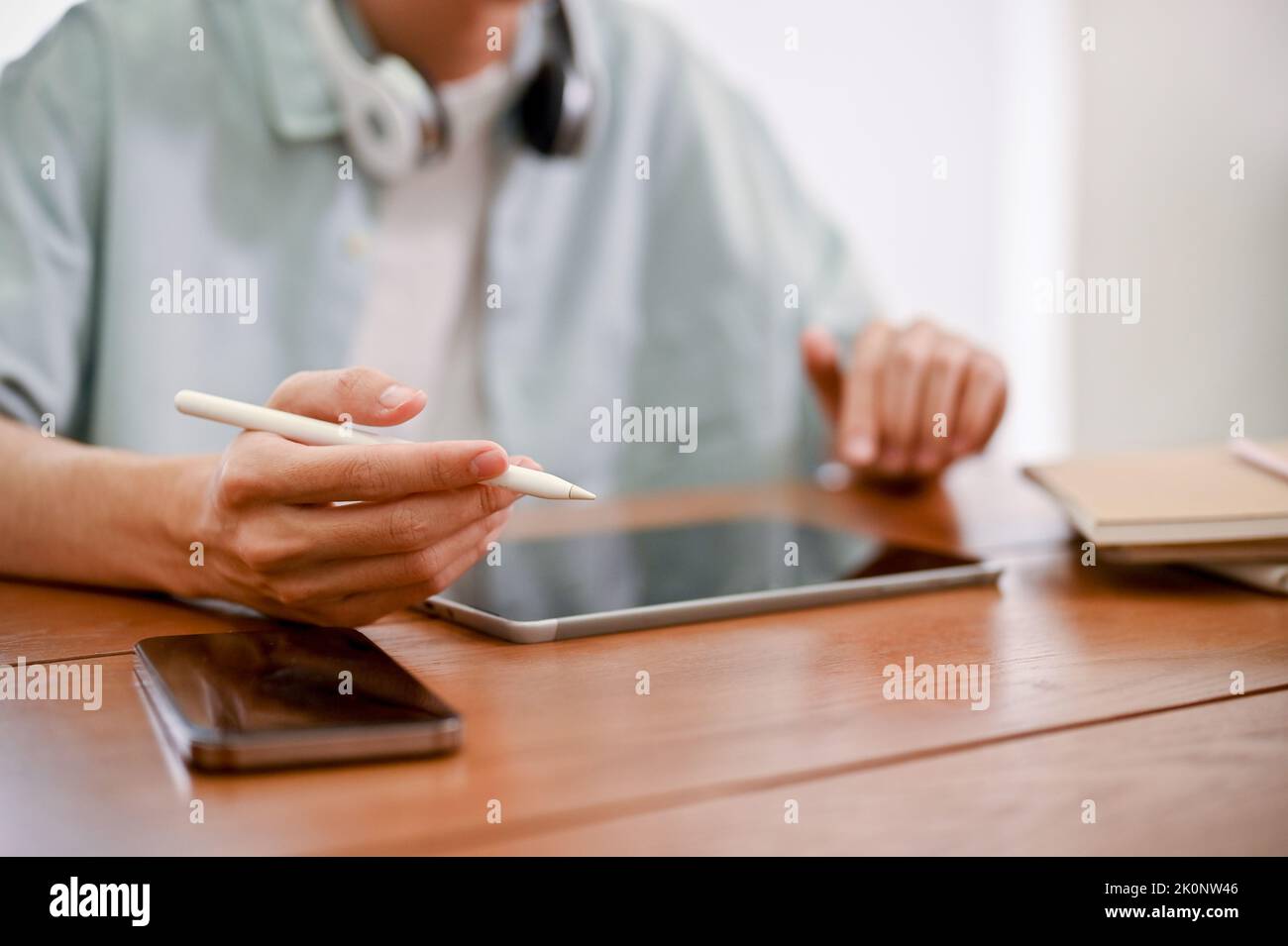 Hipster male freelancer or college student using digital tablet to ...