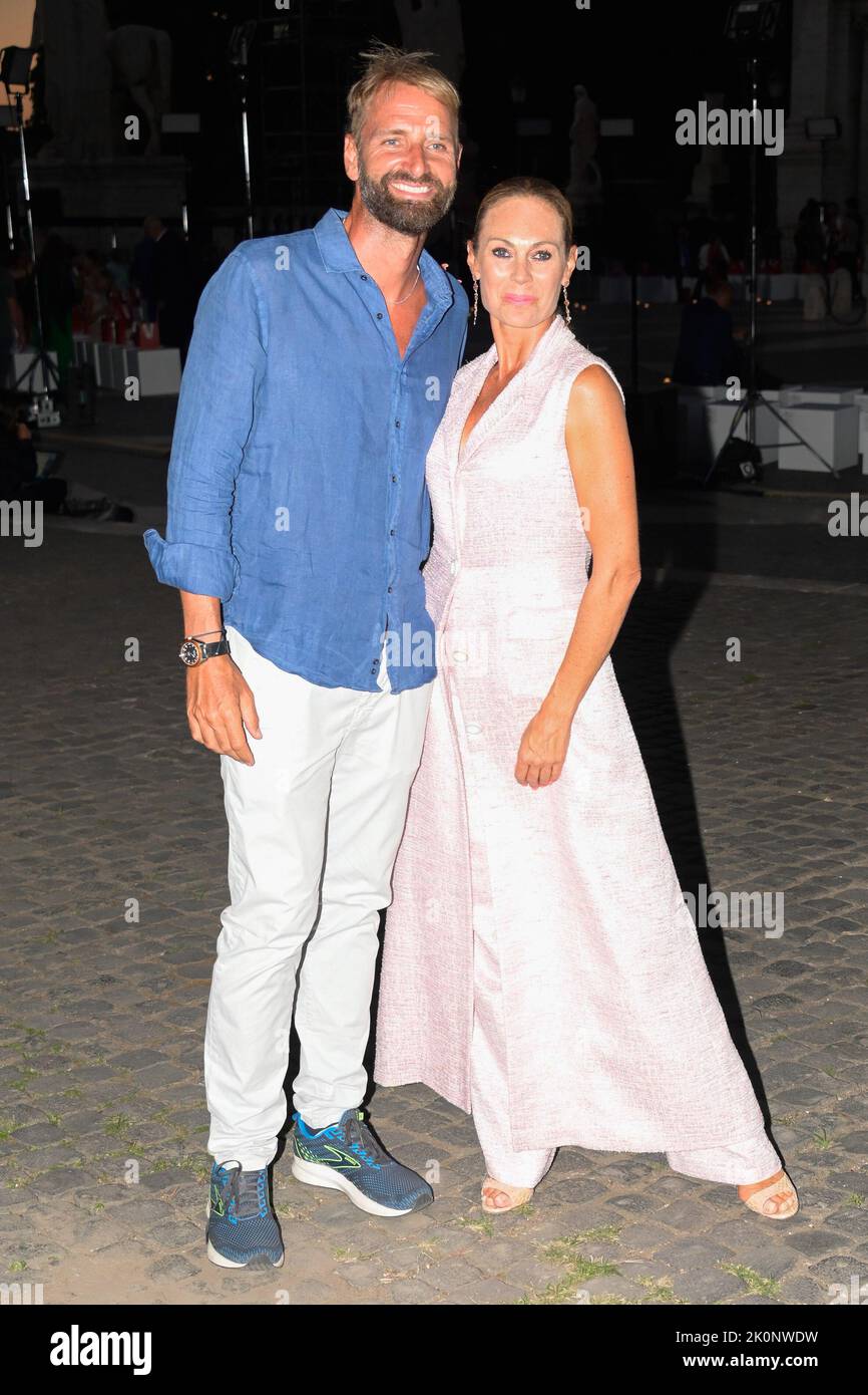 Massimiliano Rosolino (left) and Natalia Titova (right) attend the ...