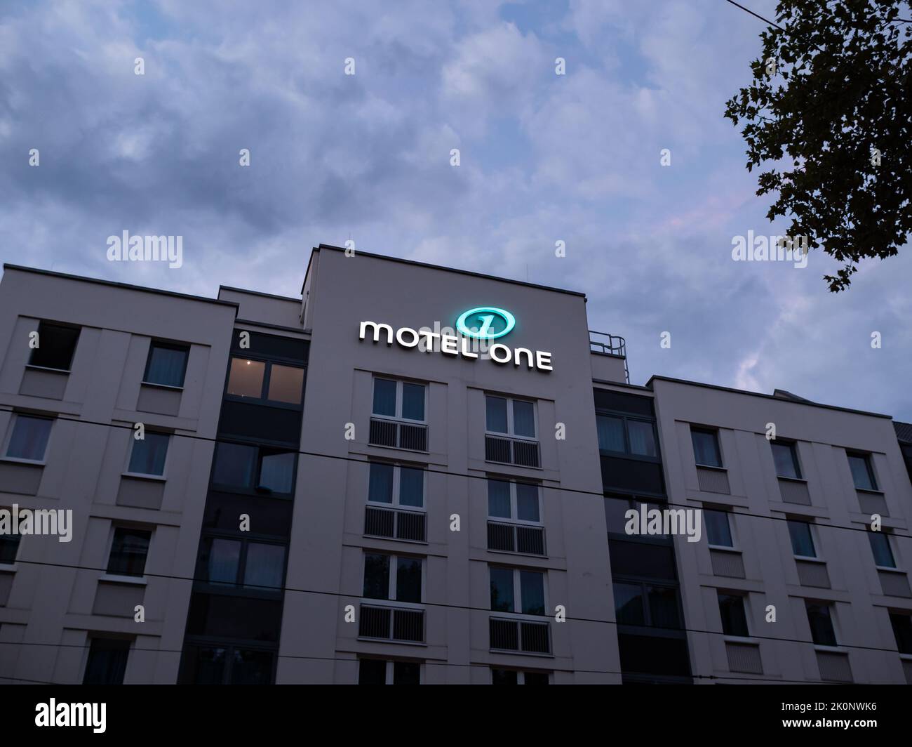 Motel One sign on a hotel building exterior in the morning. Illuminated ...
