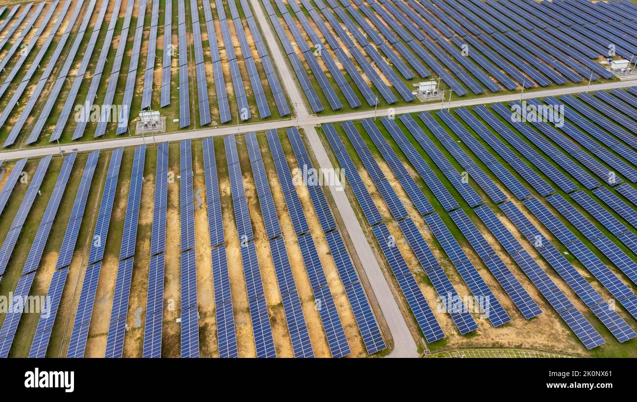 Aerial view of solar power plant on green field. Solar panels system ...