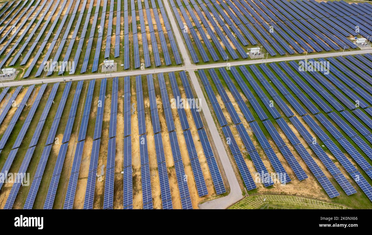 Aerial view of solar power plant on green field. Solar panels system ...
