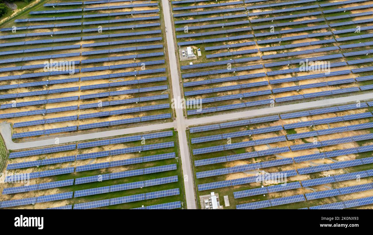 Aerial view of solar power plant on green field. Solar panels system ...
