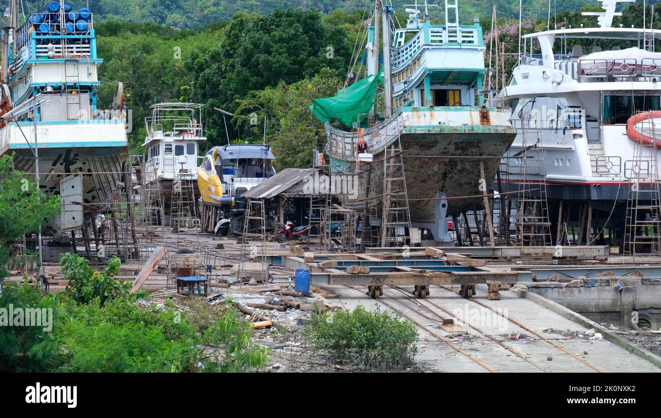 Fishing boats and luxury yachts in the shipyard for maintenance Stock ...