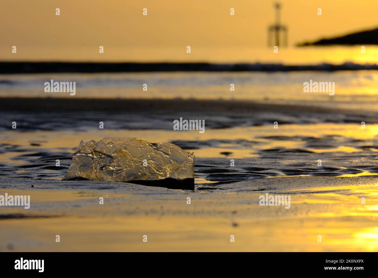 Dirty used plastic waste on the beach. Problem of spilled rubbish trash ...