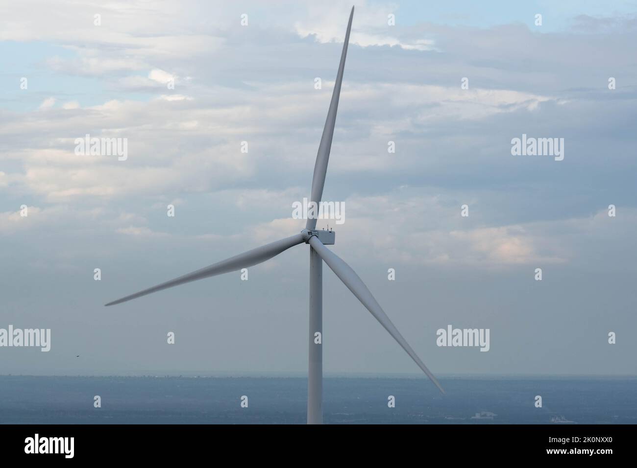 Windmill for electric power production on mountain and blue sky ...
