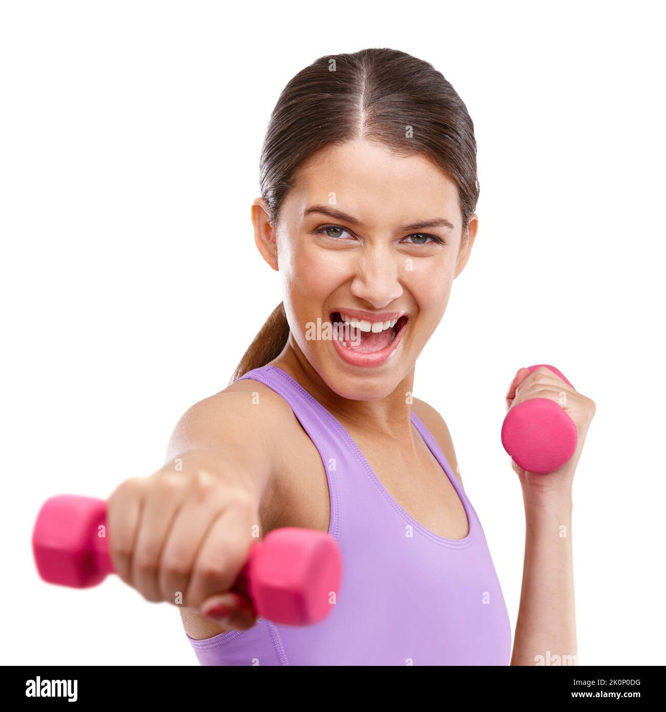 Make things happen. Studio portrait of a beautiful young woman lifting ...
