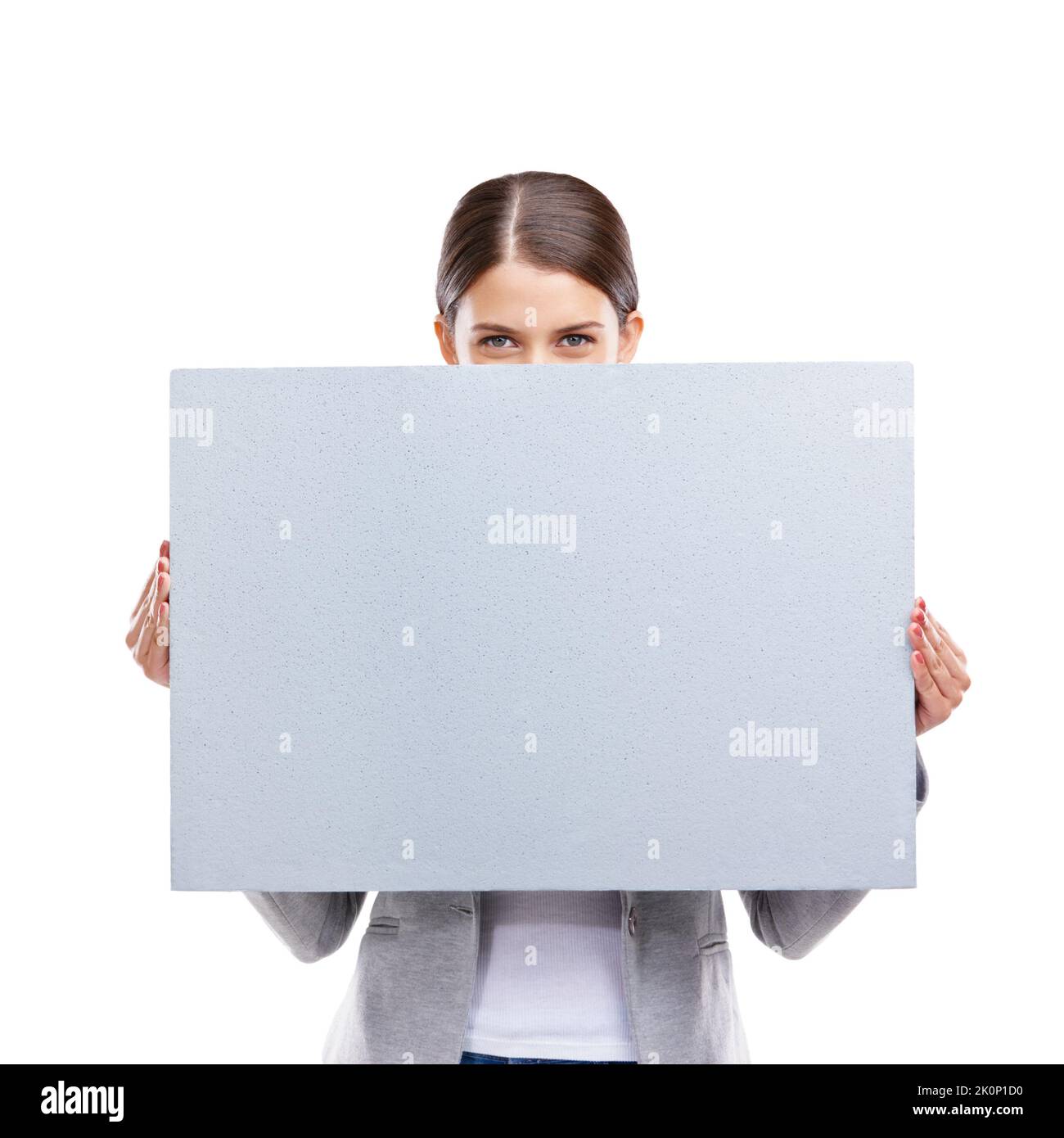 Lets get you noticed. Studio shot of a beautiful young woman holding a ...