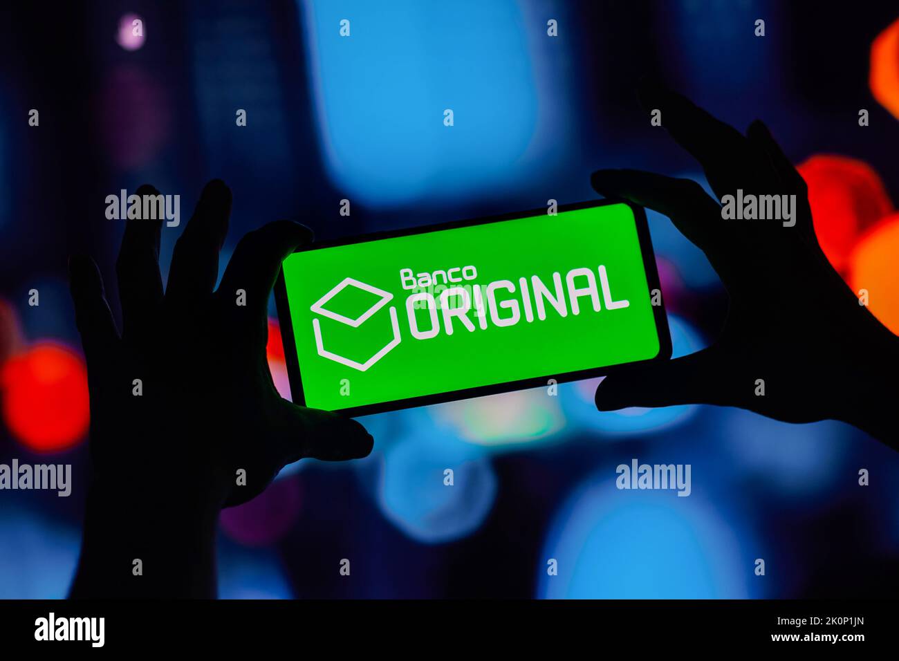 In this photo illustration, the Banco Original logo seen displayed on a ...