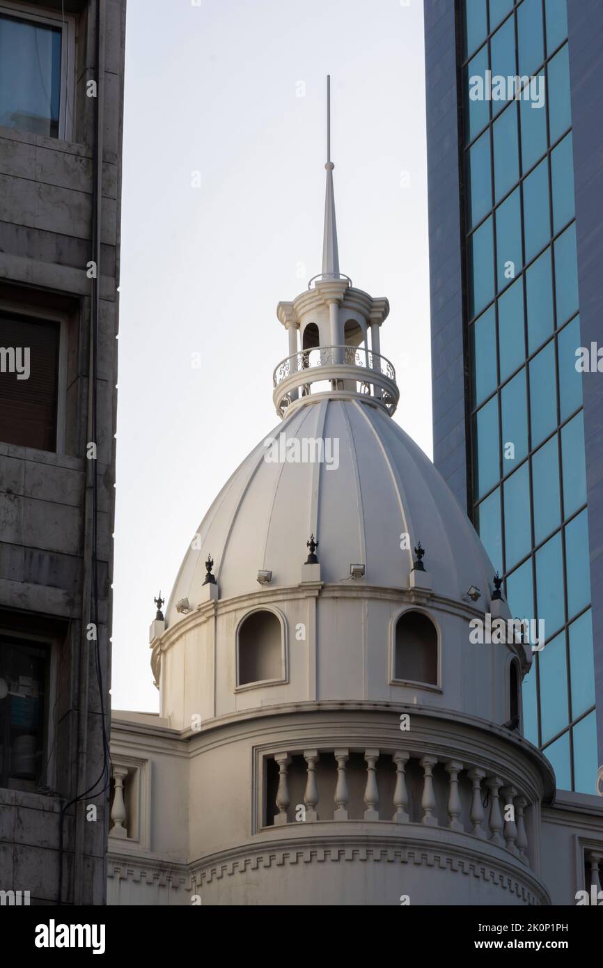Low angle of church dome beside modern building Stock Photo - Alamy