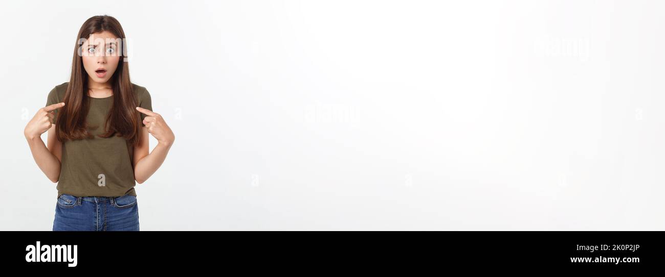 Portrait happy and surprised young lady standing isolated over grey ...