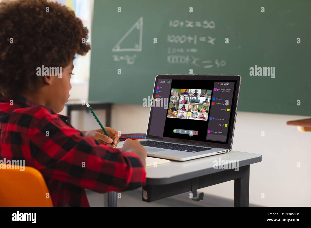 African american boy using laptop for video call, with diverse ...