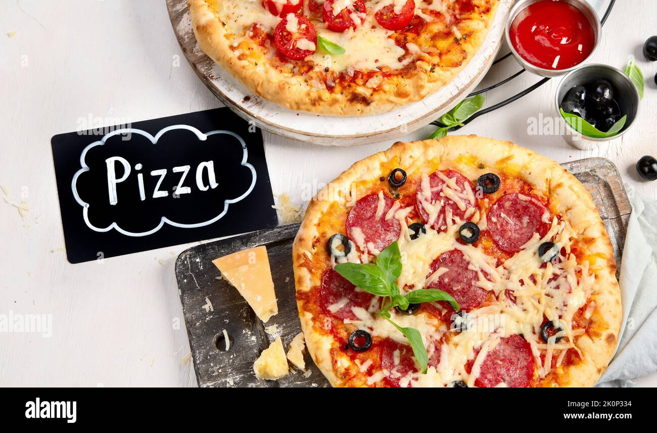 Freshly baked pizza on dark background. Tasty homemade food concept ...