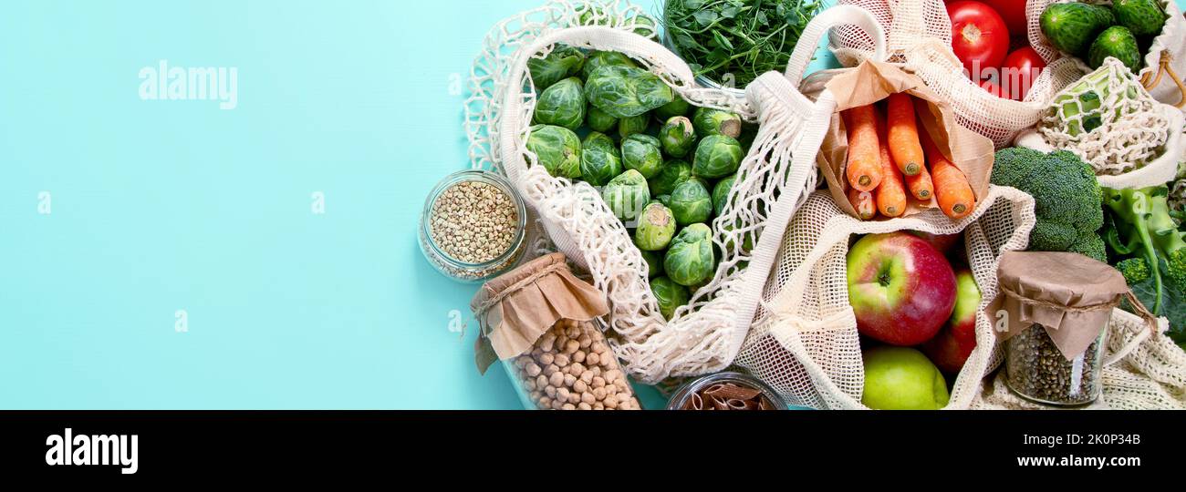 Various organic fruits and vegetables in reusable packaging bags. Eco ...