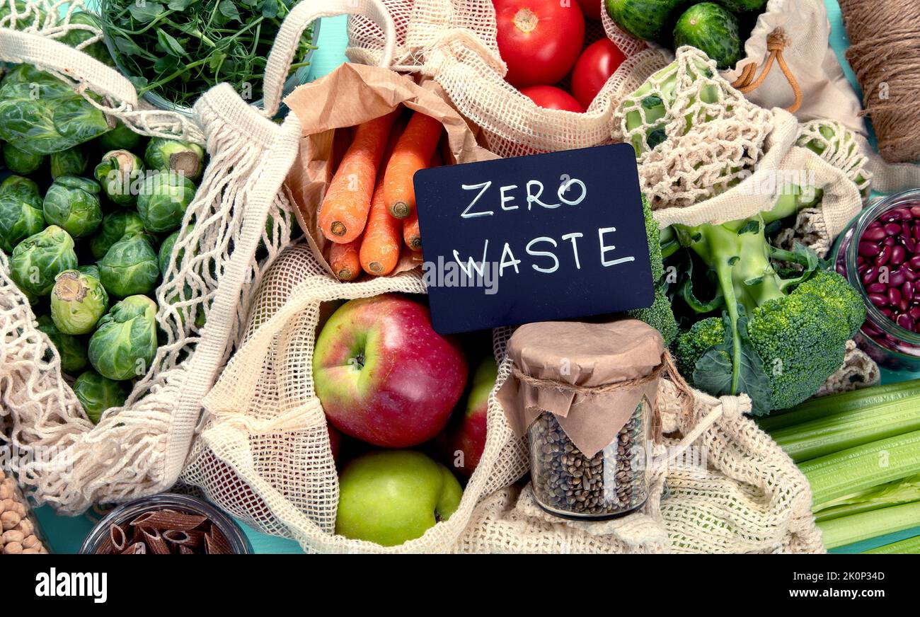 Various organic fruits and vegetables in reusable packaging bags. Eco ...