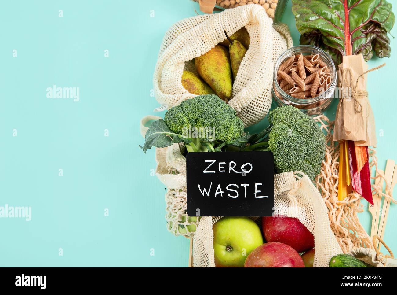 Various organic fruits and vegetables in reusable packaging bags. Eco ...