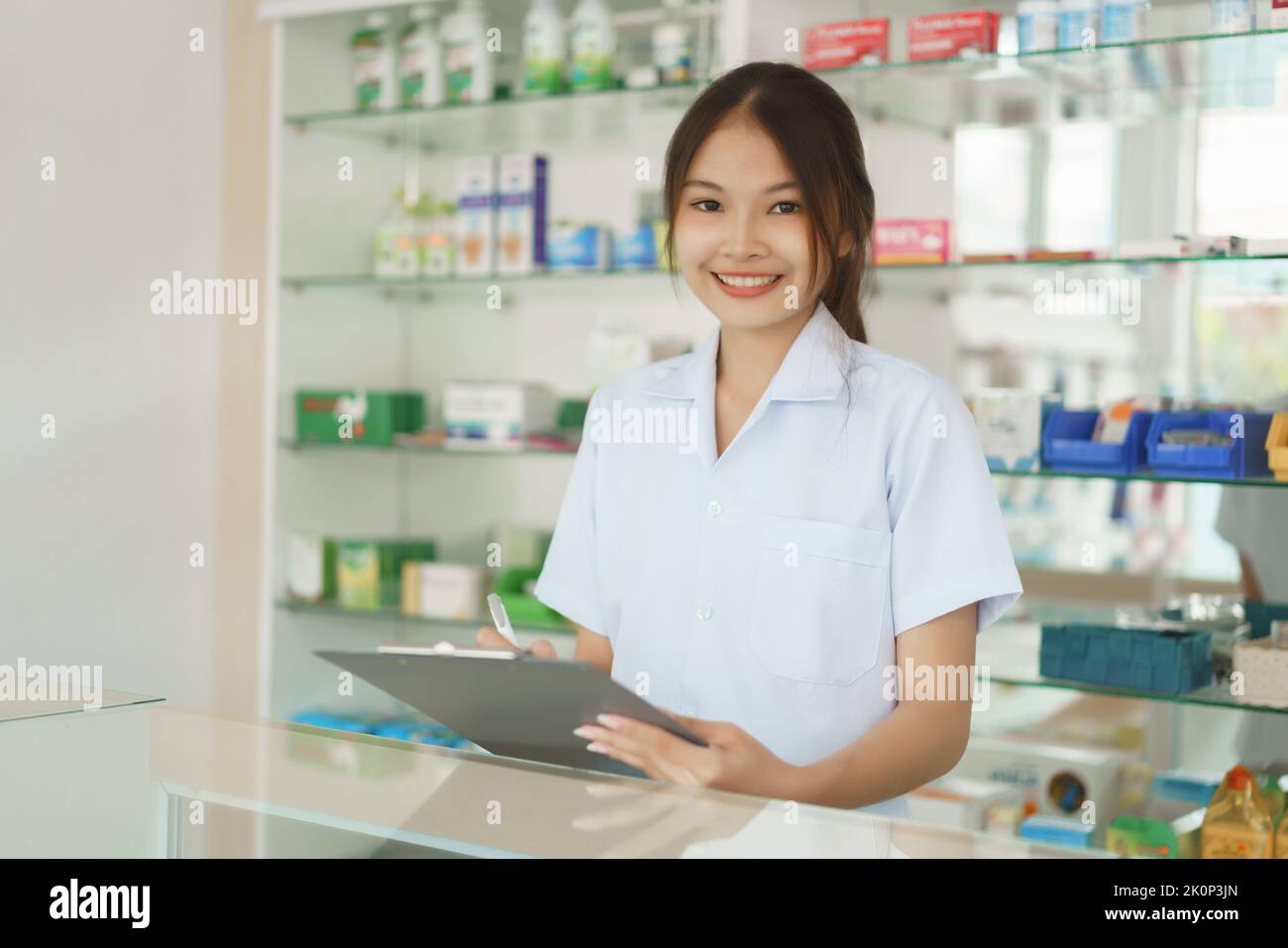 Medicine and health concept, Female pharmacist is checking stock ...