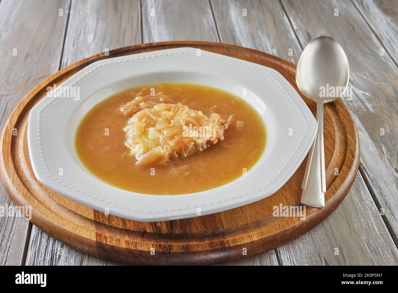 French recipe onion soup in bowl with spoon. French gourmet food Stock ...