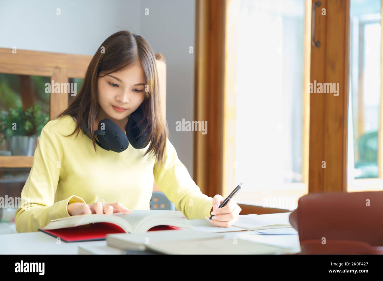 Education and literacy concept, College student girl reading textbook ...