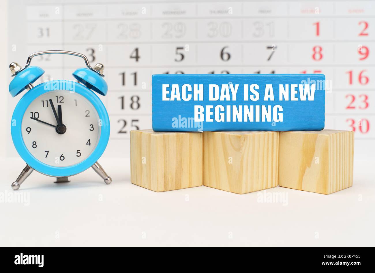 Time concept. Against the background of the calendar is an alarm clock ...